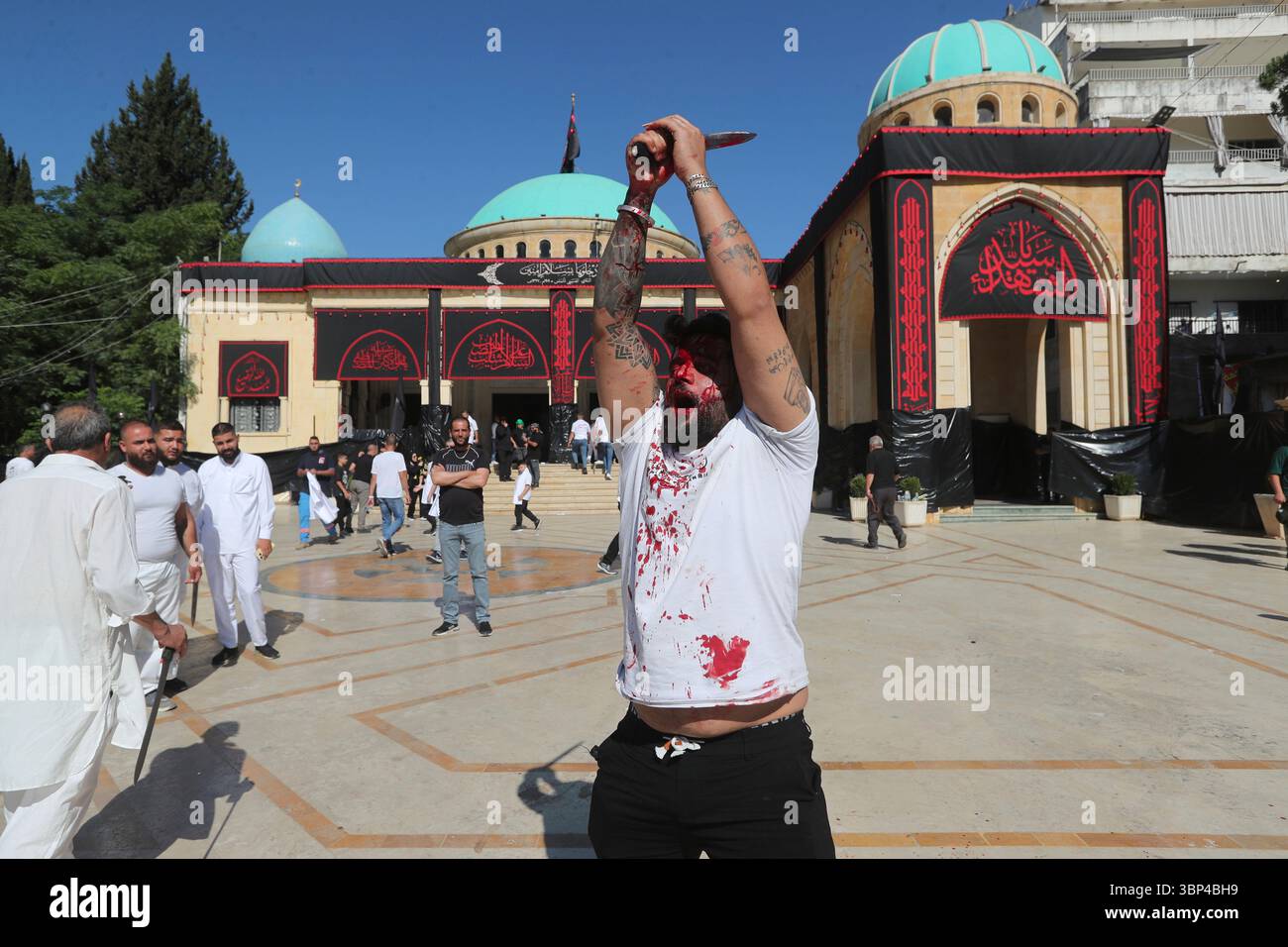 EDS NOTE: GRAPHIC CONTENT - A Lebanese Shiite strikes his head with a ...
