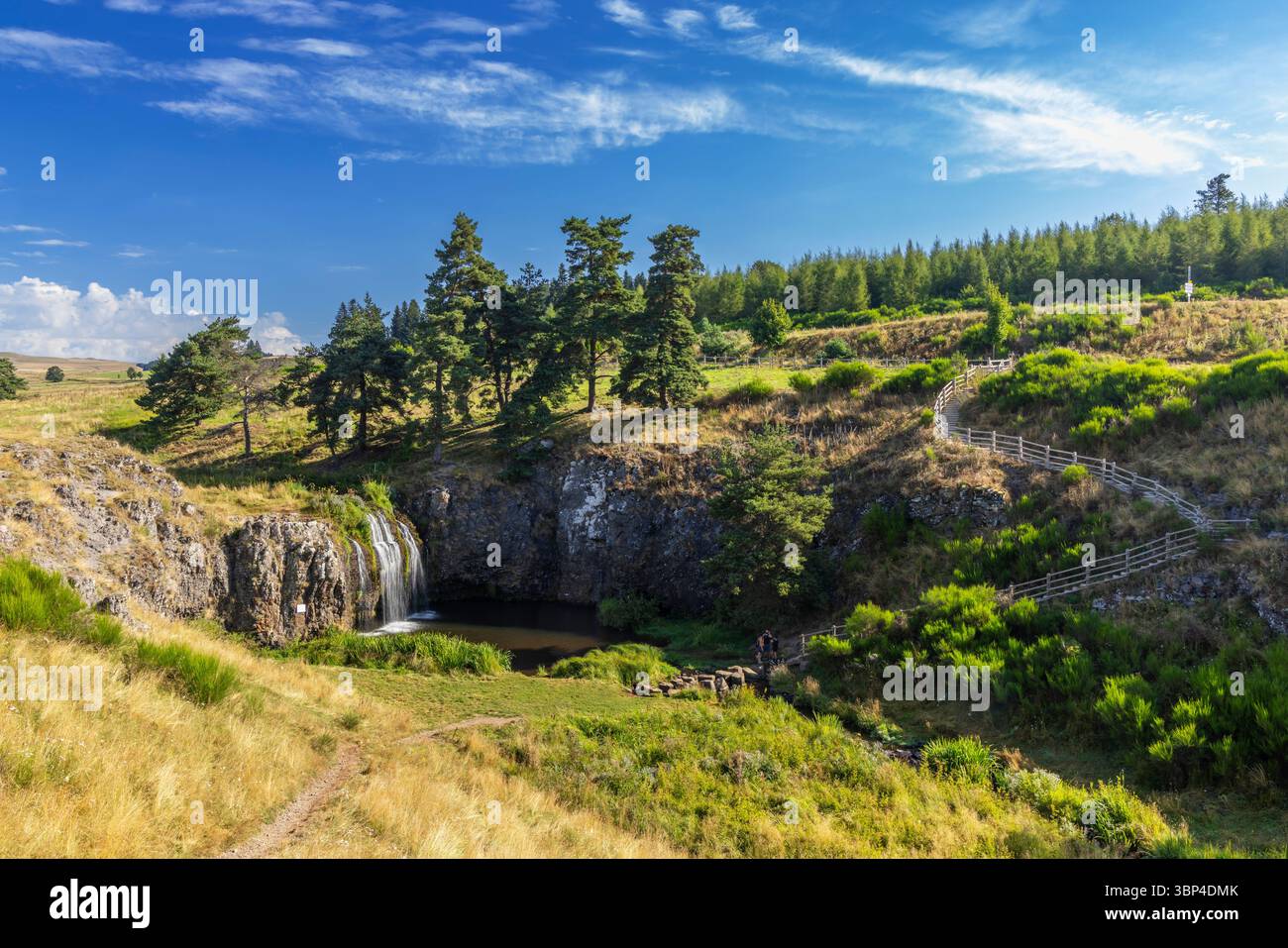 Serene landscape featuring a waterfall and lush greenery in Creuse ...