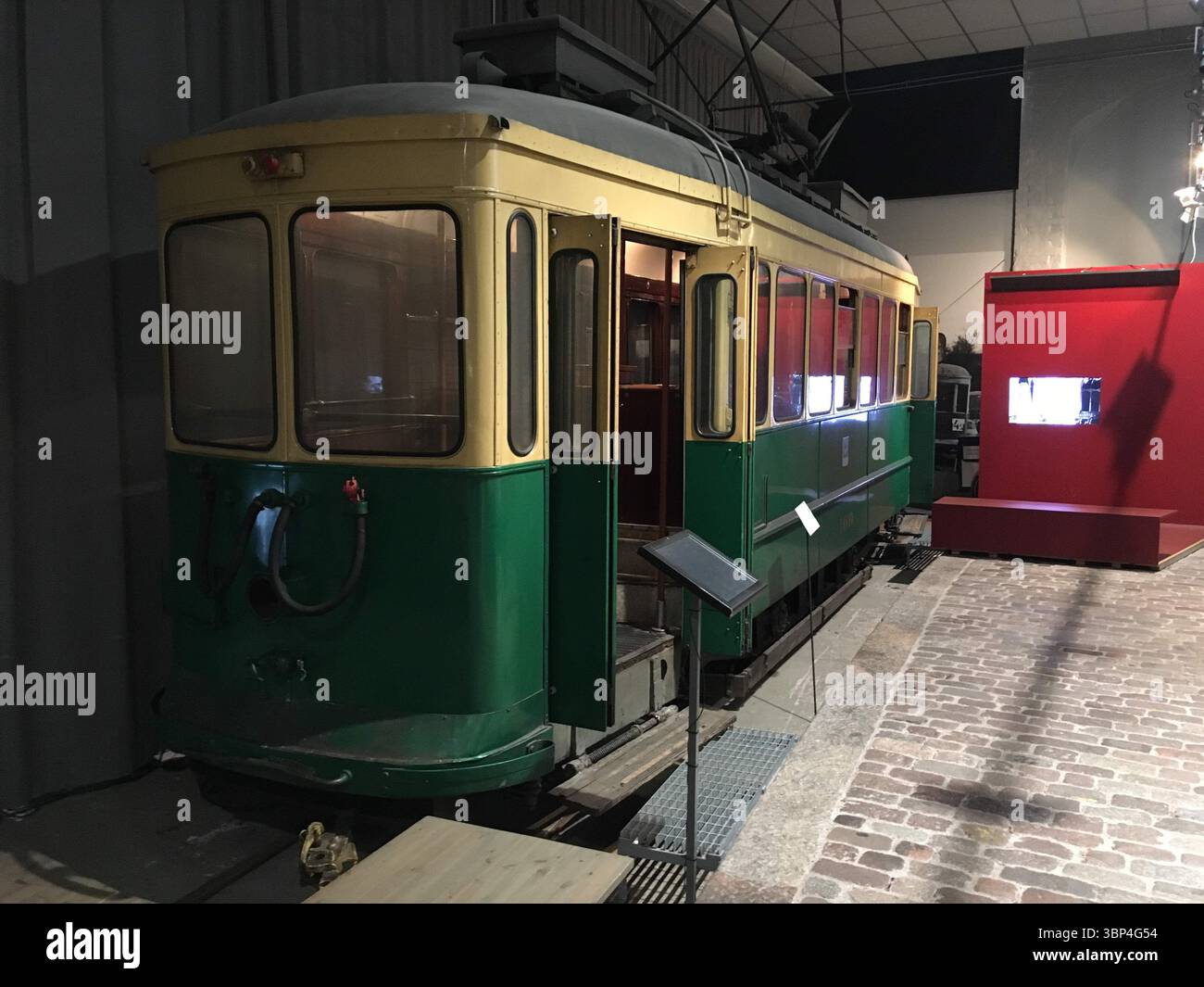 Interior views of the Helsinki Tram Museum’s historic depot, showcasing ...