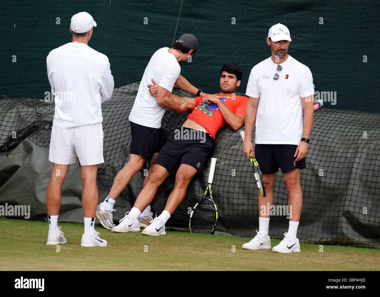 Carlos Alcaraz and his coaching team during a practice session on day ...