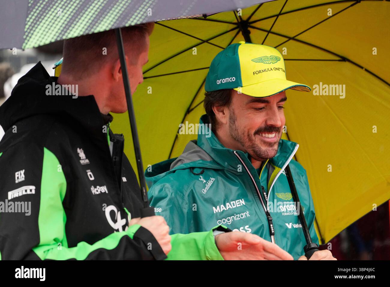 Kick Sauber driver Nico Hulkenberg of Germany, left, and Aston Martin ...