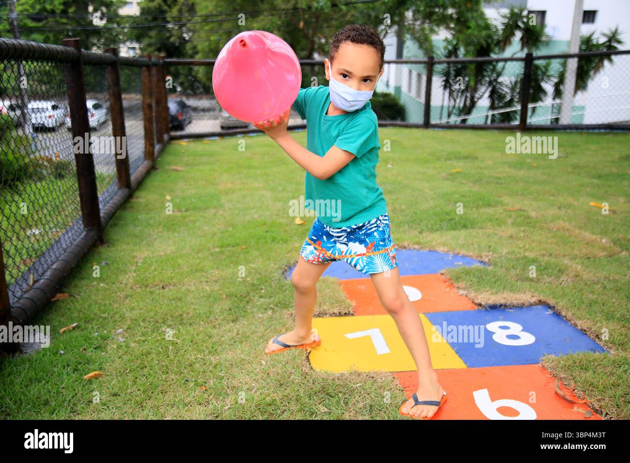 child wearing a mask during covid-19 salvador, bahia, brazil - may 15 ...