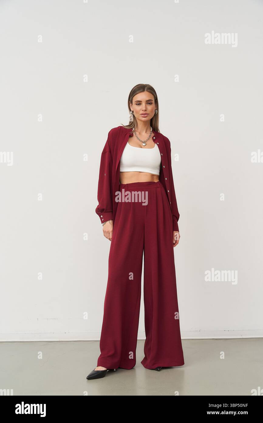 Woman stands poised dressed hi-res stock photography and images - Alamy