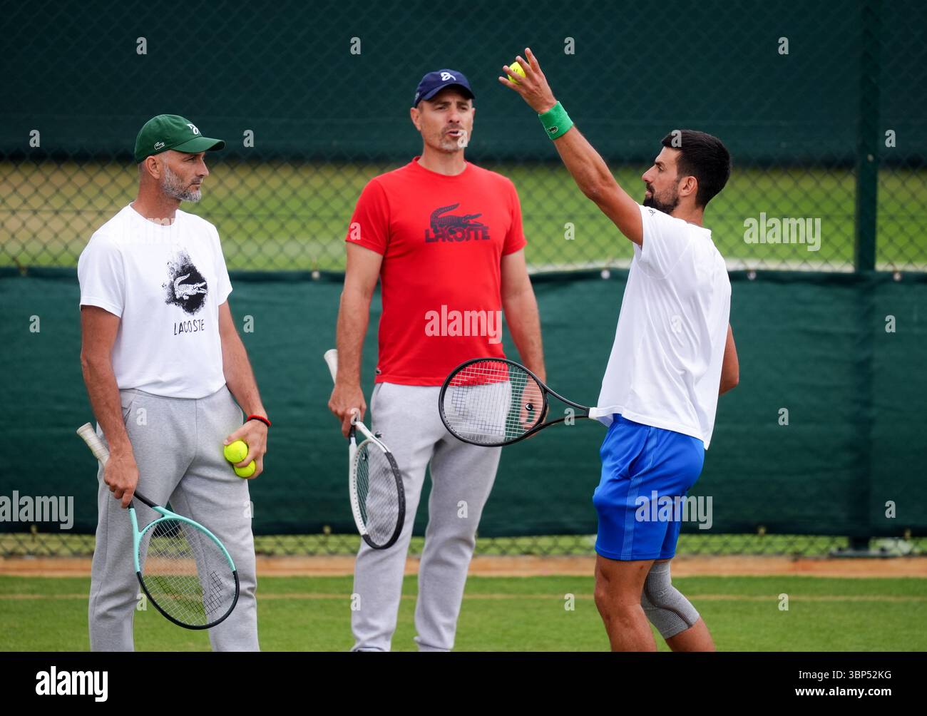 Novak Djokovic with coach Dusan Vemic (left) during a practice session ...