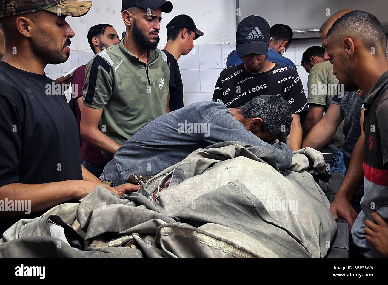 Relatives of Palestinians, who lost their loved ones following an ...