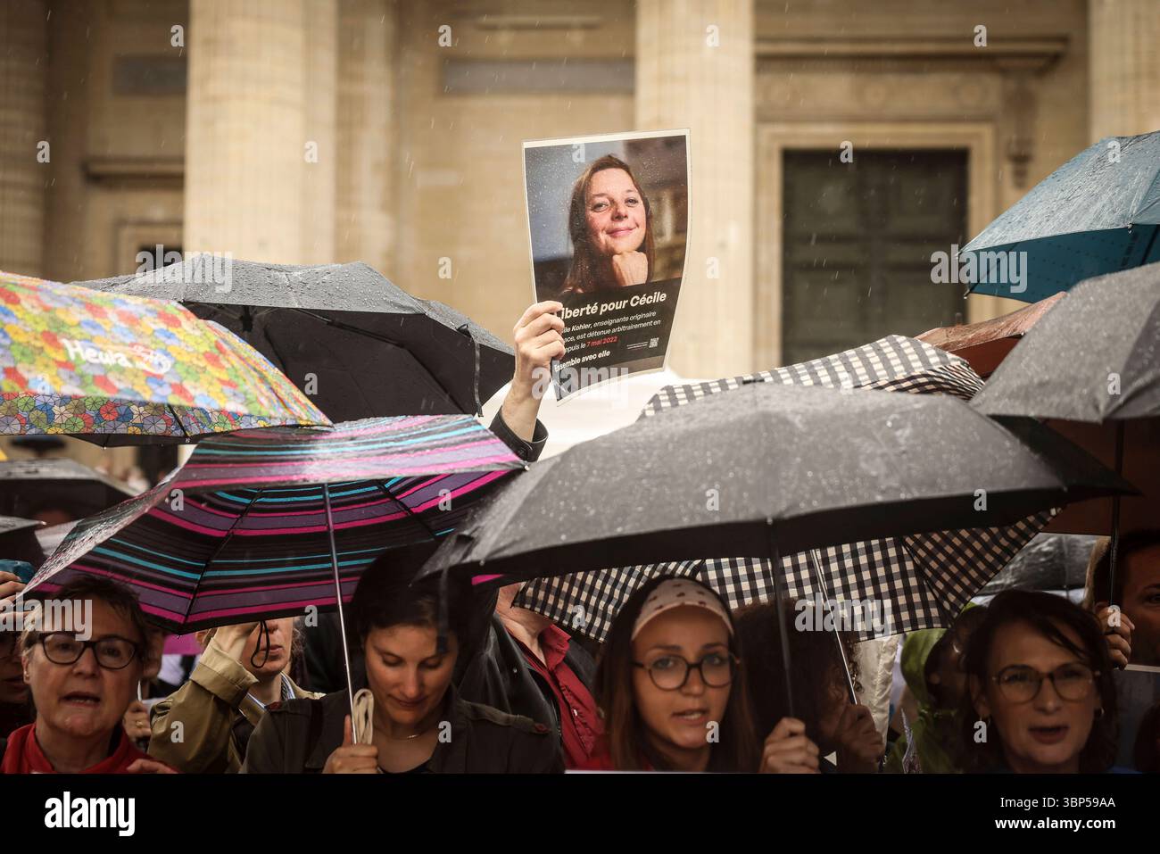 People holds portrait of French detainee in Iran Cecile Kohler during a ...