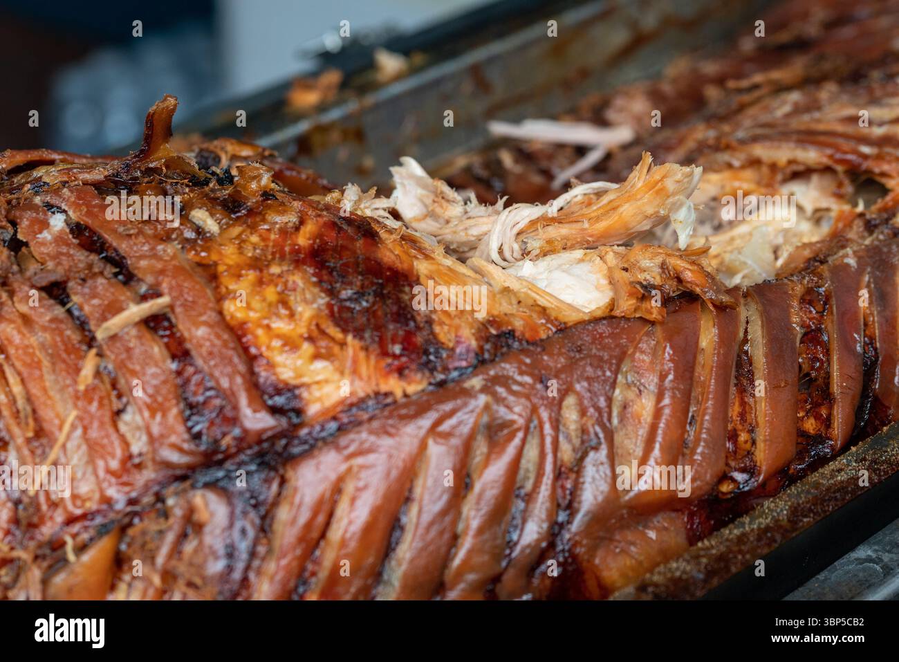 Hog roast with meat and crackling skin at a food festival Stock Photo ...
