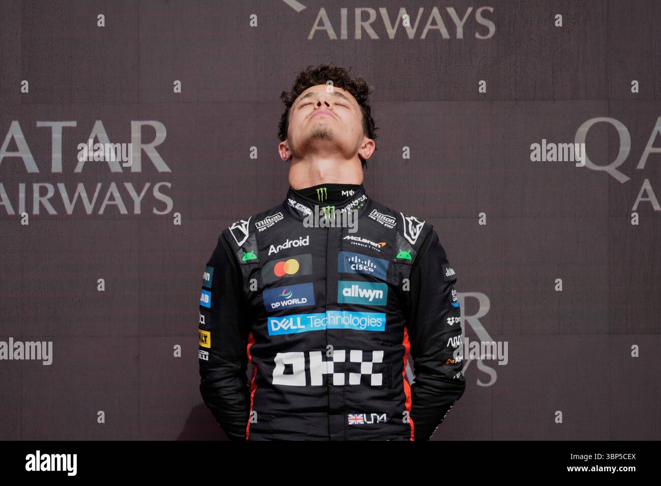 McLaren driver Lando Norris of Britain reacts as he stands on the ...