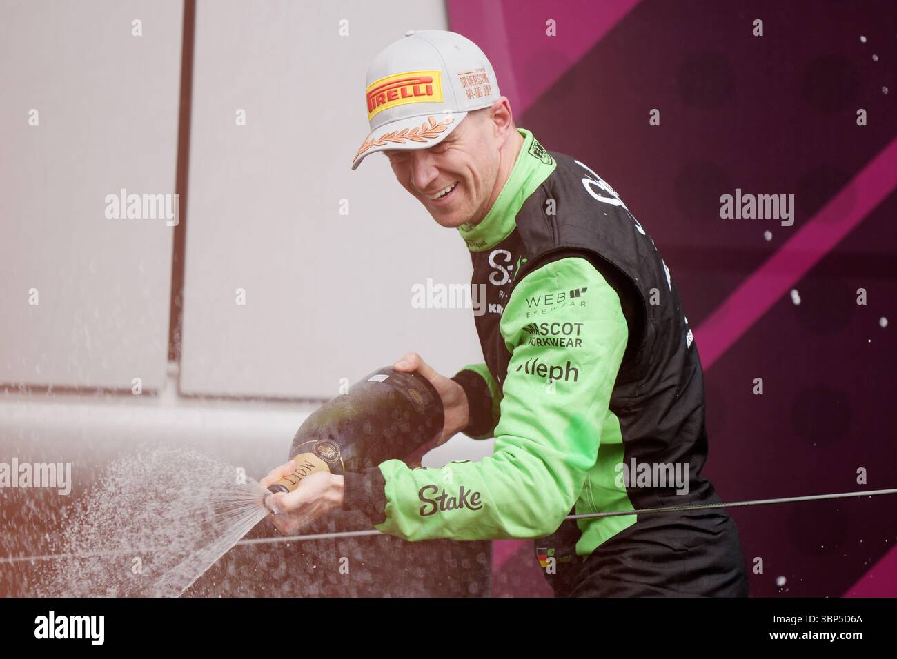 Kick Sauber driver Nico Hulkenberg celebrates on the podium after ...