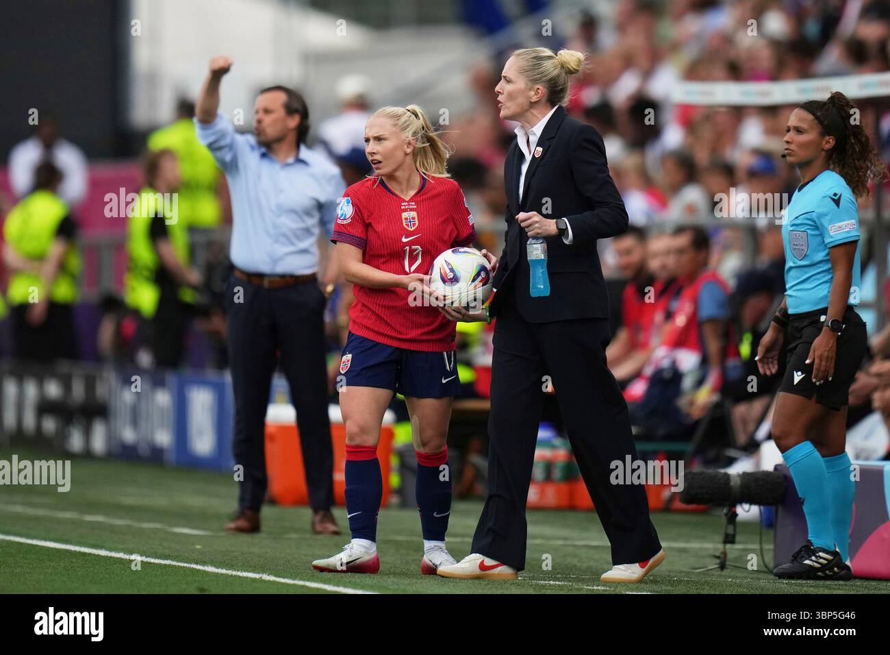 Norway head coach Gemma Grainger hands the ball to Norway's Thea Bjelde ...