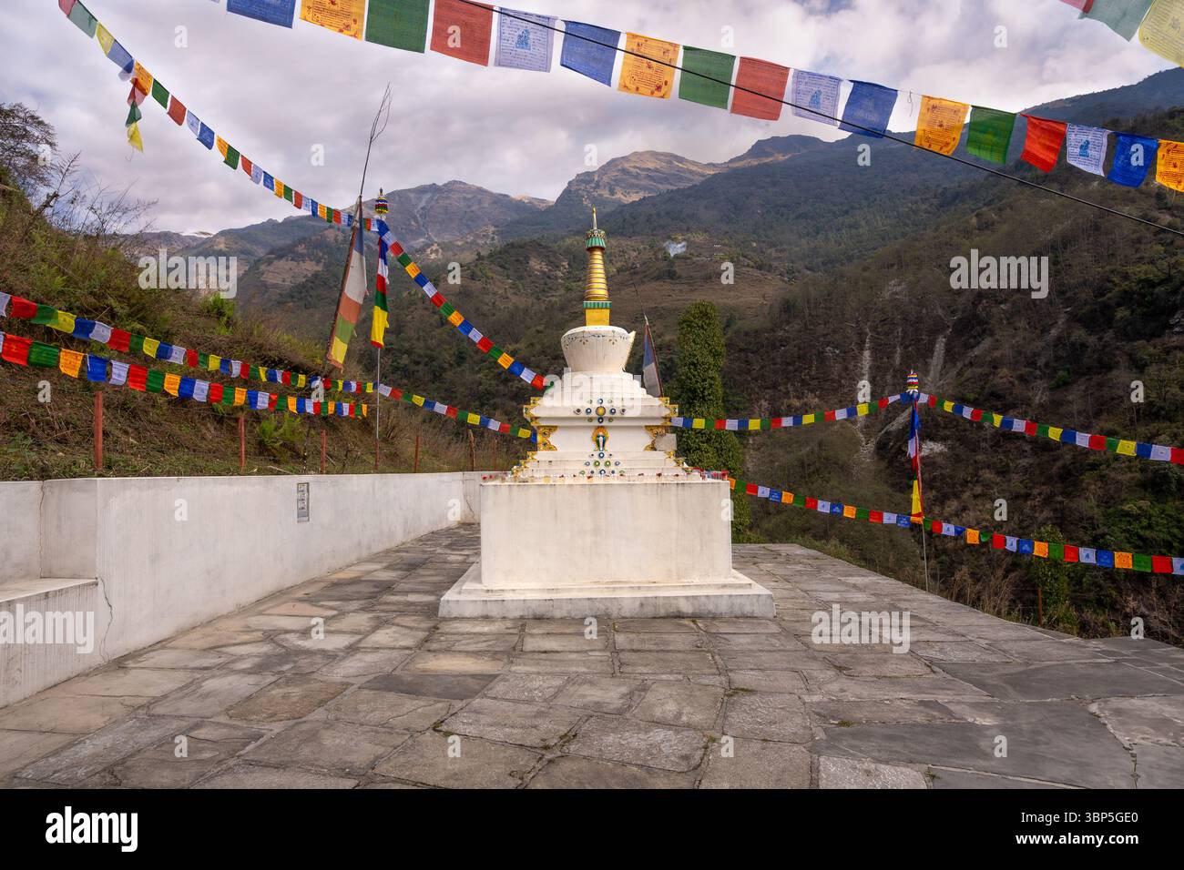 White buddhist Stupa with tradition tibetan prayer flags in Himalayan ...