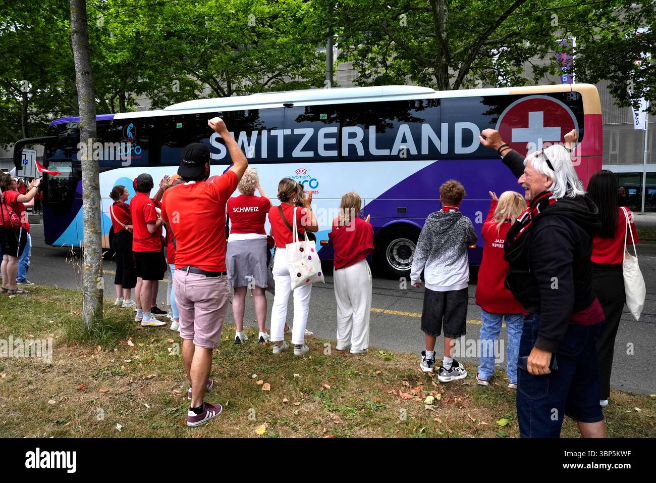 Switzerland fans watch the team bus arrive ahead of the UEFA Women's ...