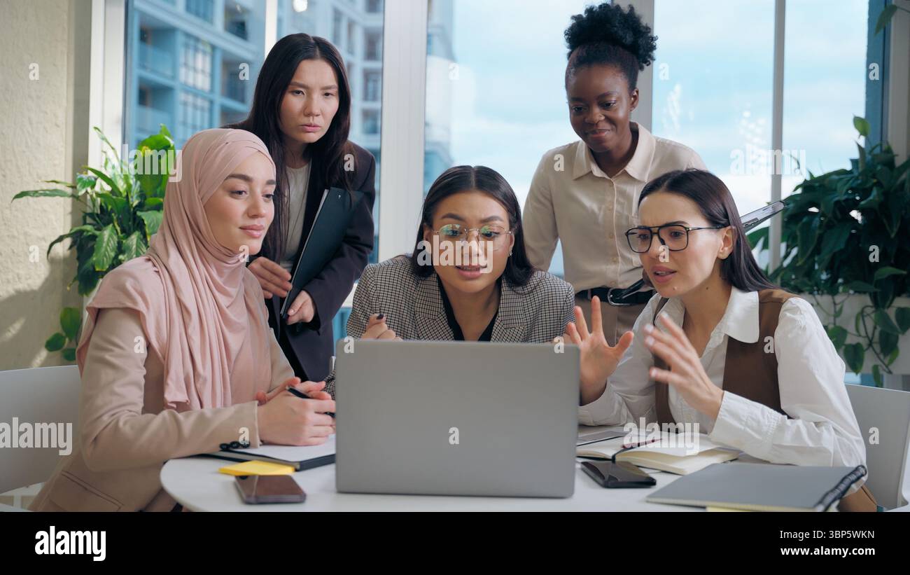 Excited shocked multiethnic women females businesswomen team colleagues multiracial group ...