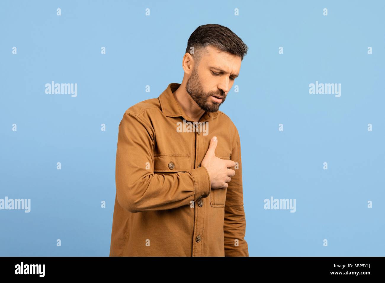 Man chest pain heart attack blue shirt hi-res stock photography and ...