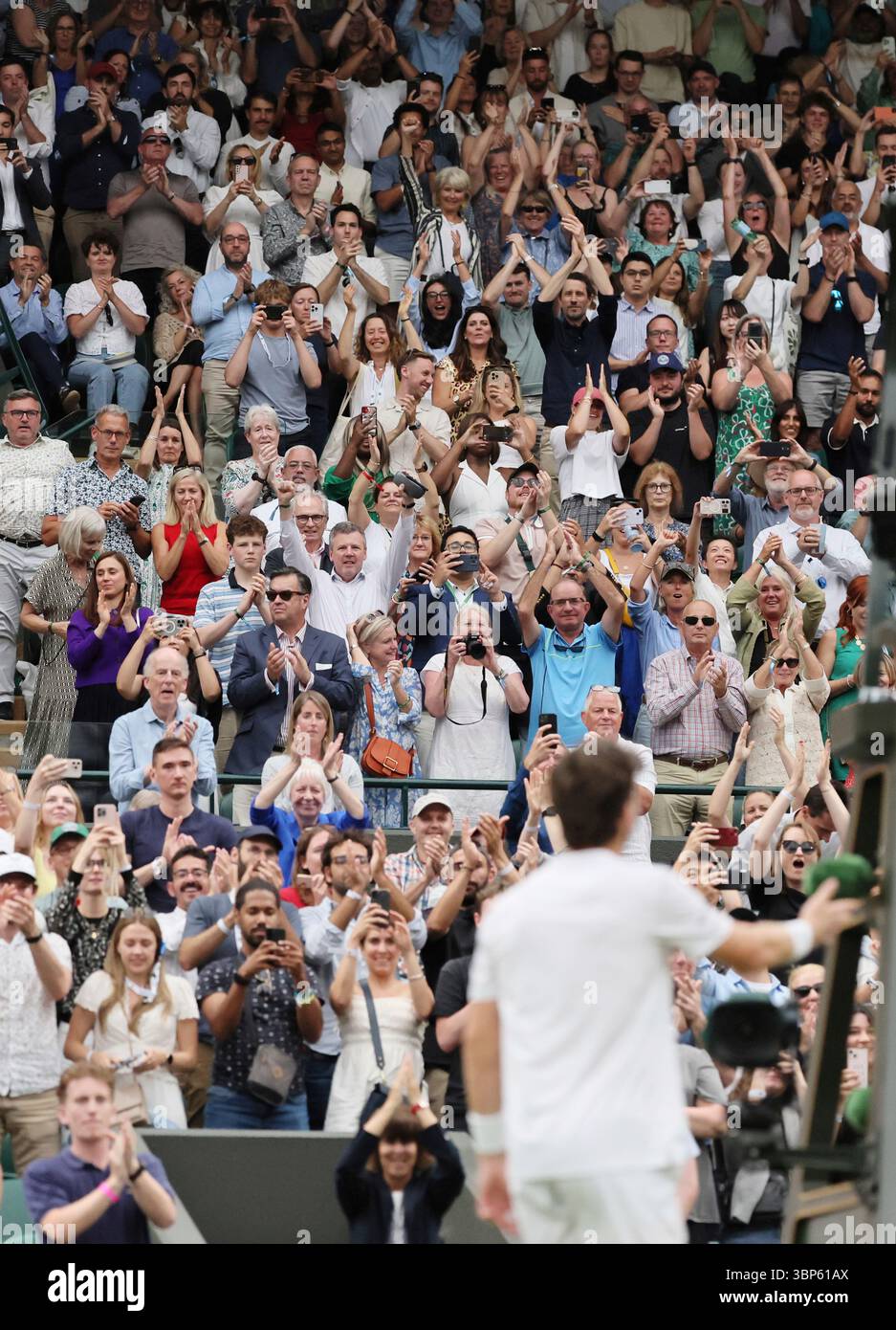 The crowd cheers for Cameron Norrie of United Kingdom after his victory ...