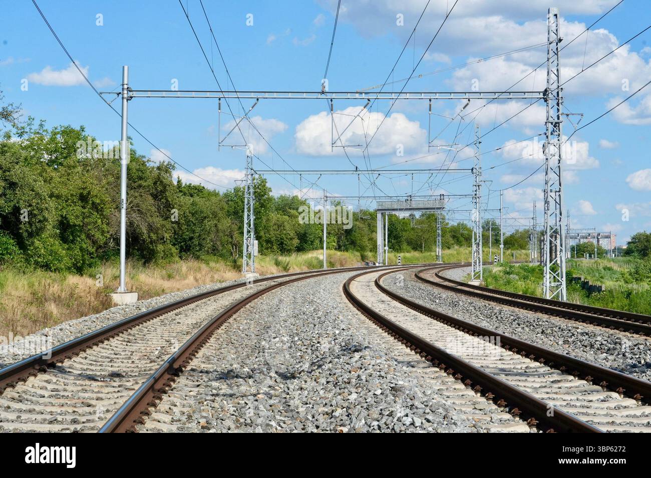 Countryside railway. Trees around the track Stock Photo - Alamy