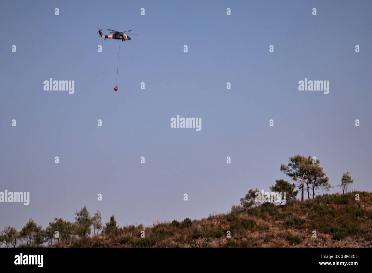 Jordanian Black Hawk helicopters carry out water-filling operations to ...