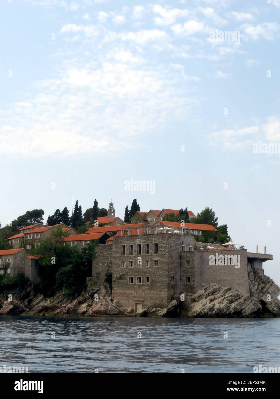 Sveti Stefan island resort showcases elegant stone buildings among lush ...
