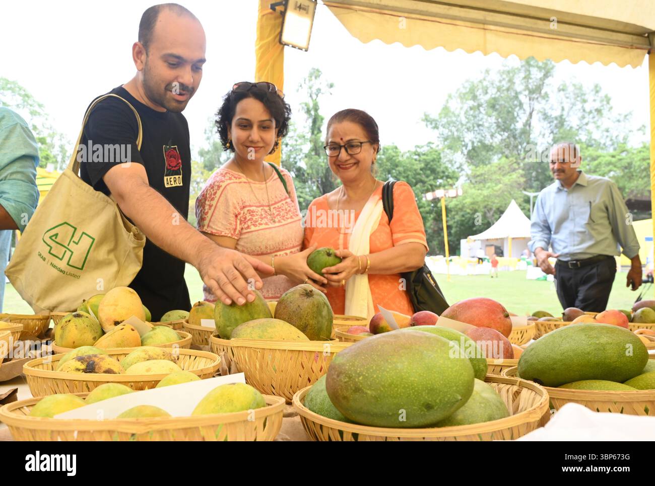 NEW DELHI, INDIA - JULY 5: People look at mangoes during the two day ...