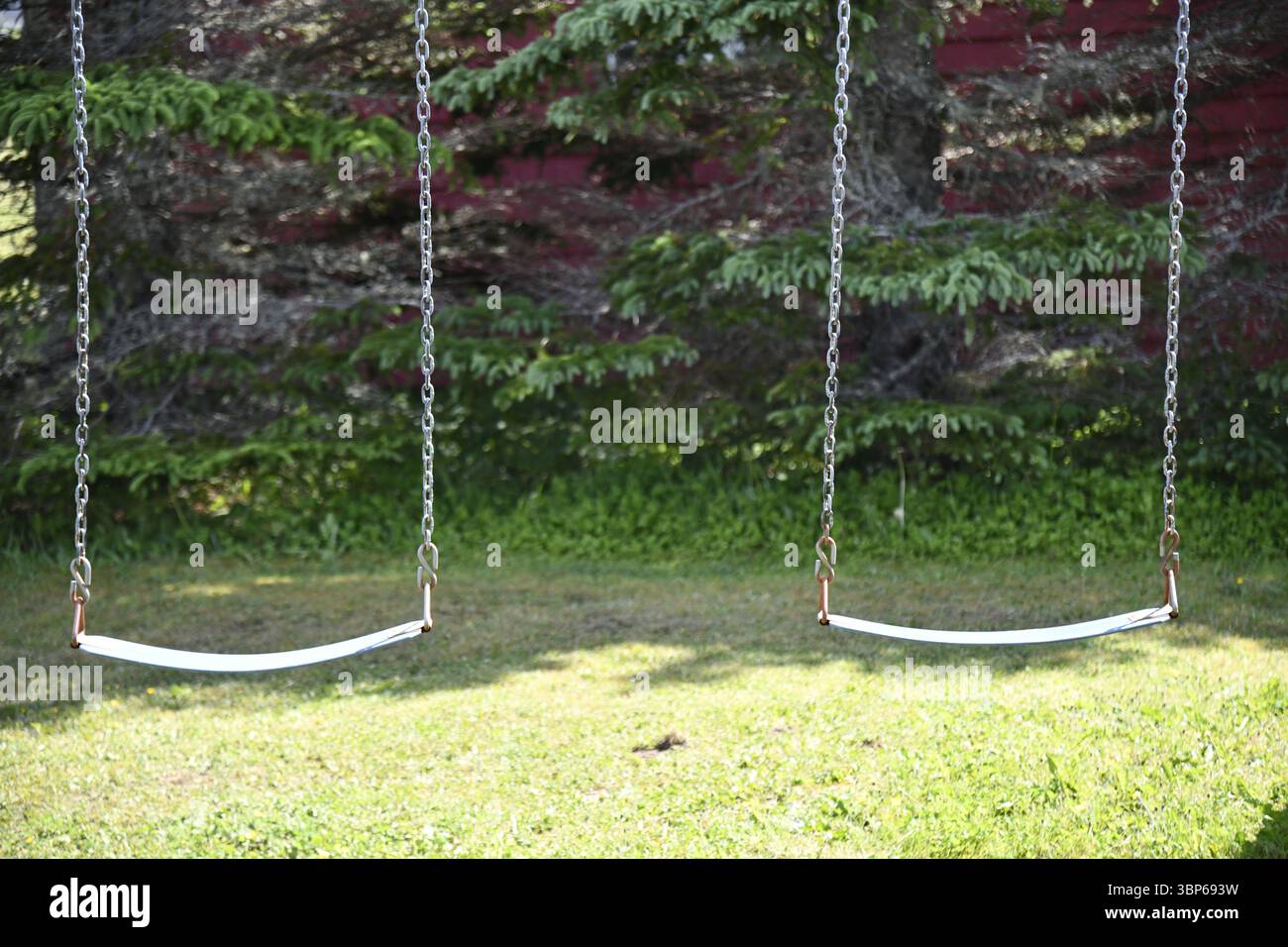 Empty swings sunny day hi-res stock photography and images - Alamy