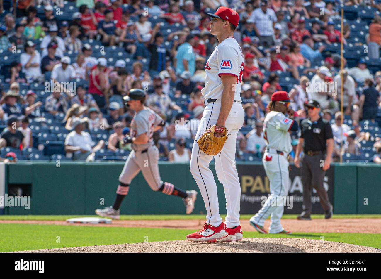 Cleveland Guardians relief pitcher Cade Smith, foreground, looks to ...