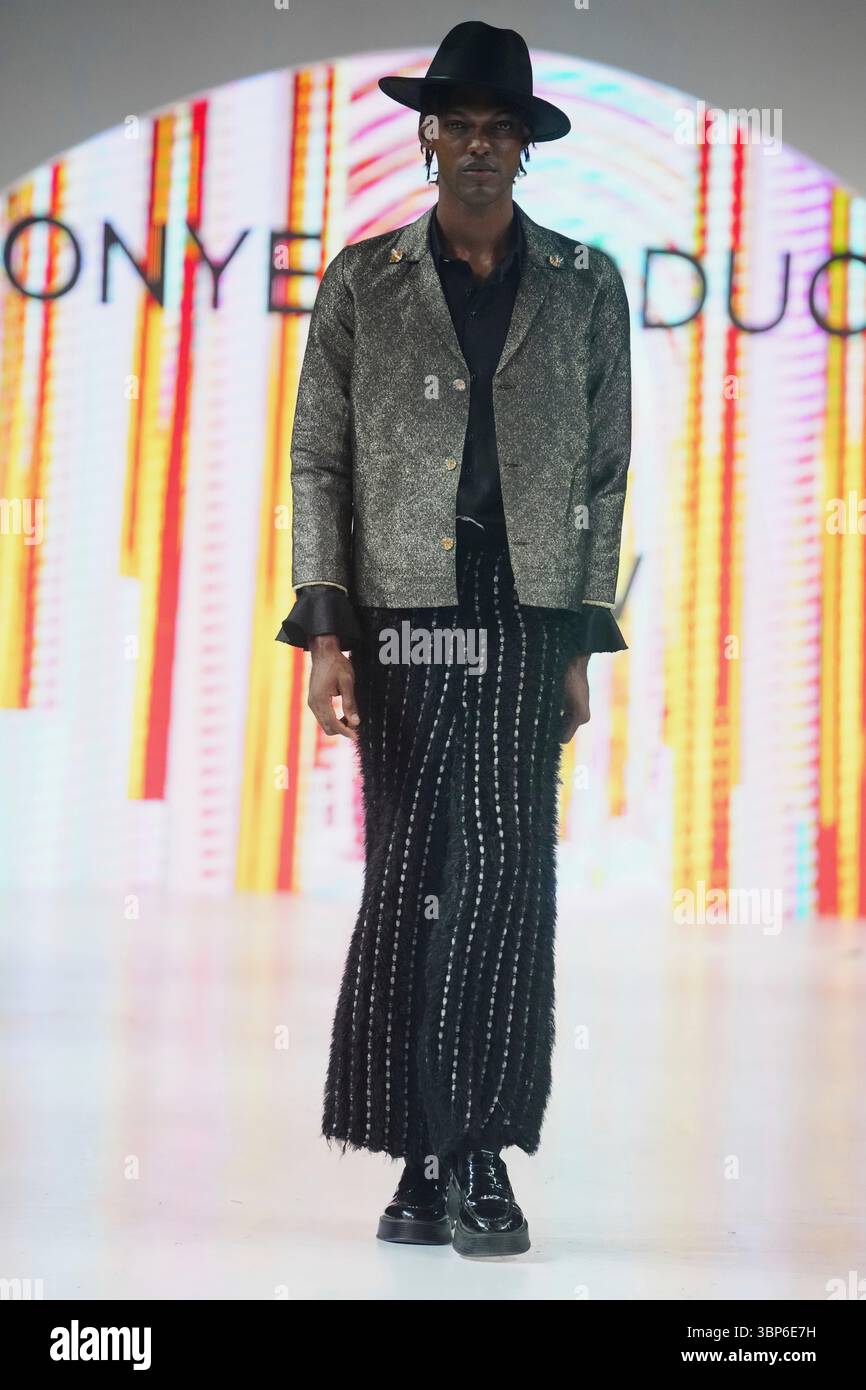 A model wears a creation by designer ONYE - DUODUO during the Fashions ...