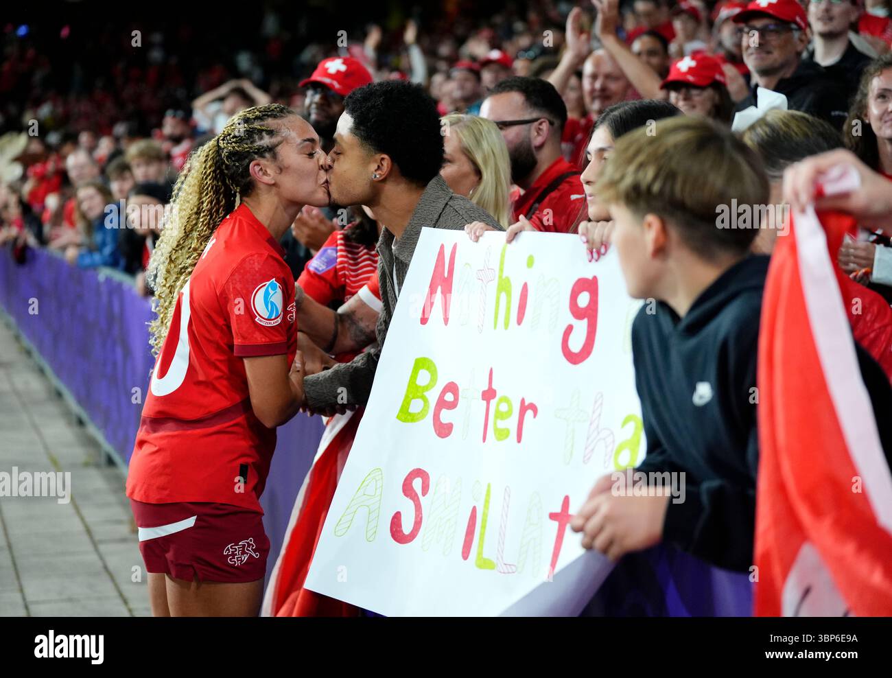Switzerland's Alayah Pilgrim kisses partner Elijah Okafor following the ...