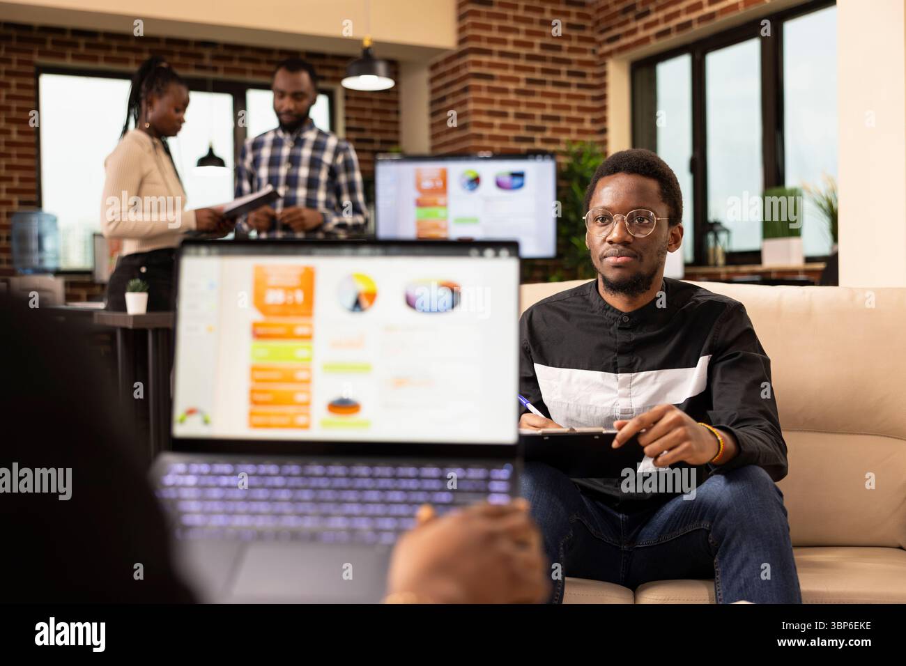 Young african american employee listens hi-res stock photography and ...