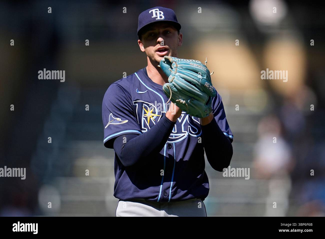 Tampa Bay Rays relief pitcher Eric Orze claps after forcing the final ...