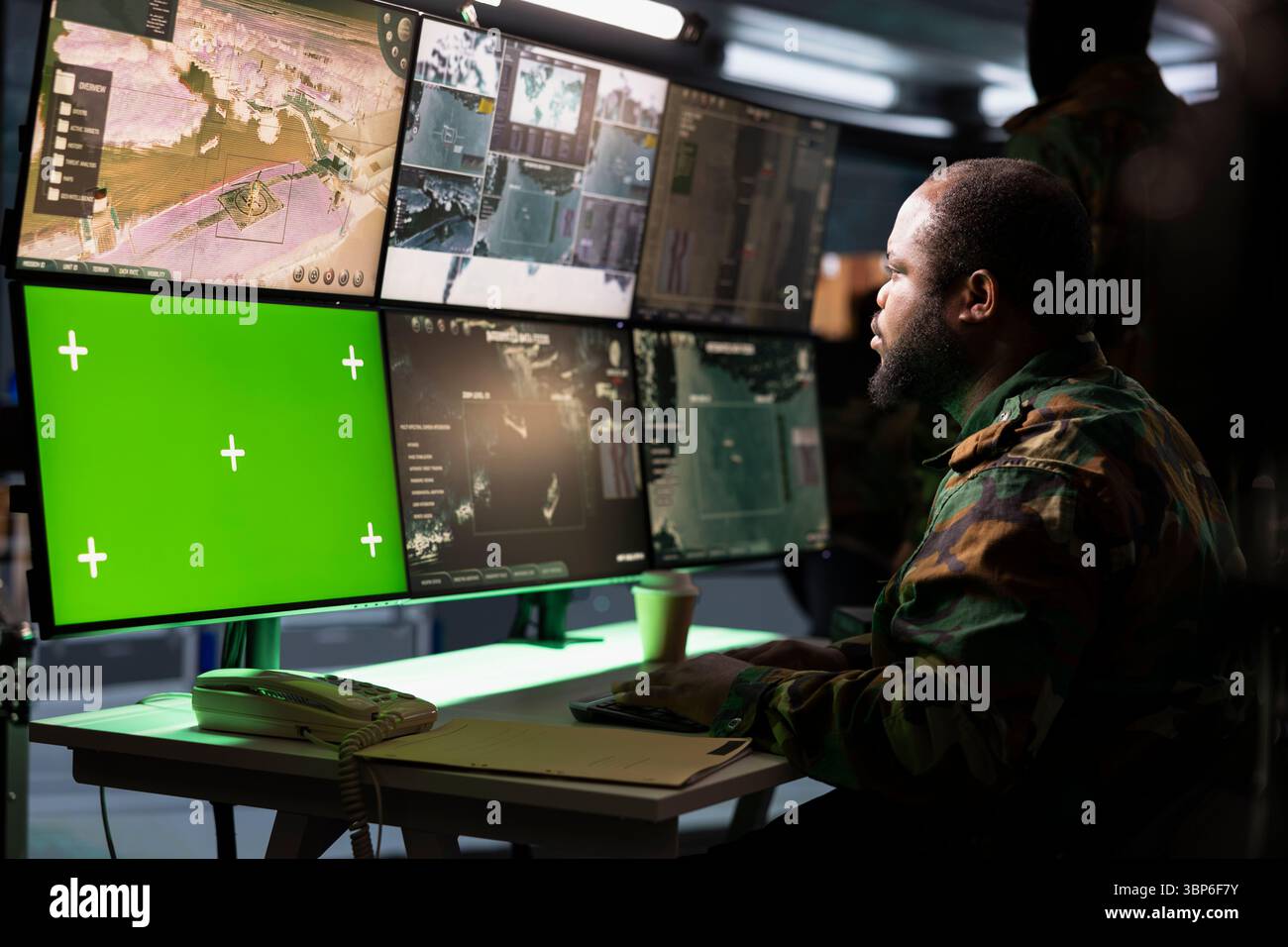 Military early warning systems operator monitoring enemy aerial attacks ...