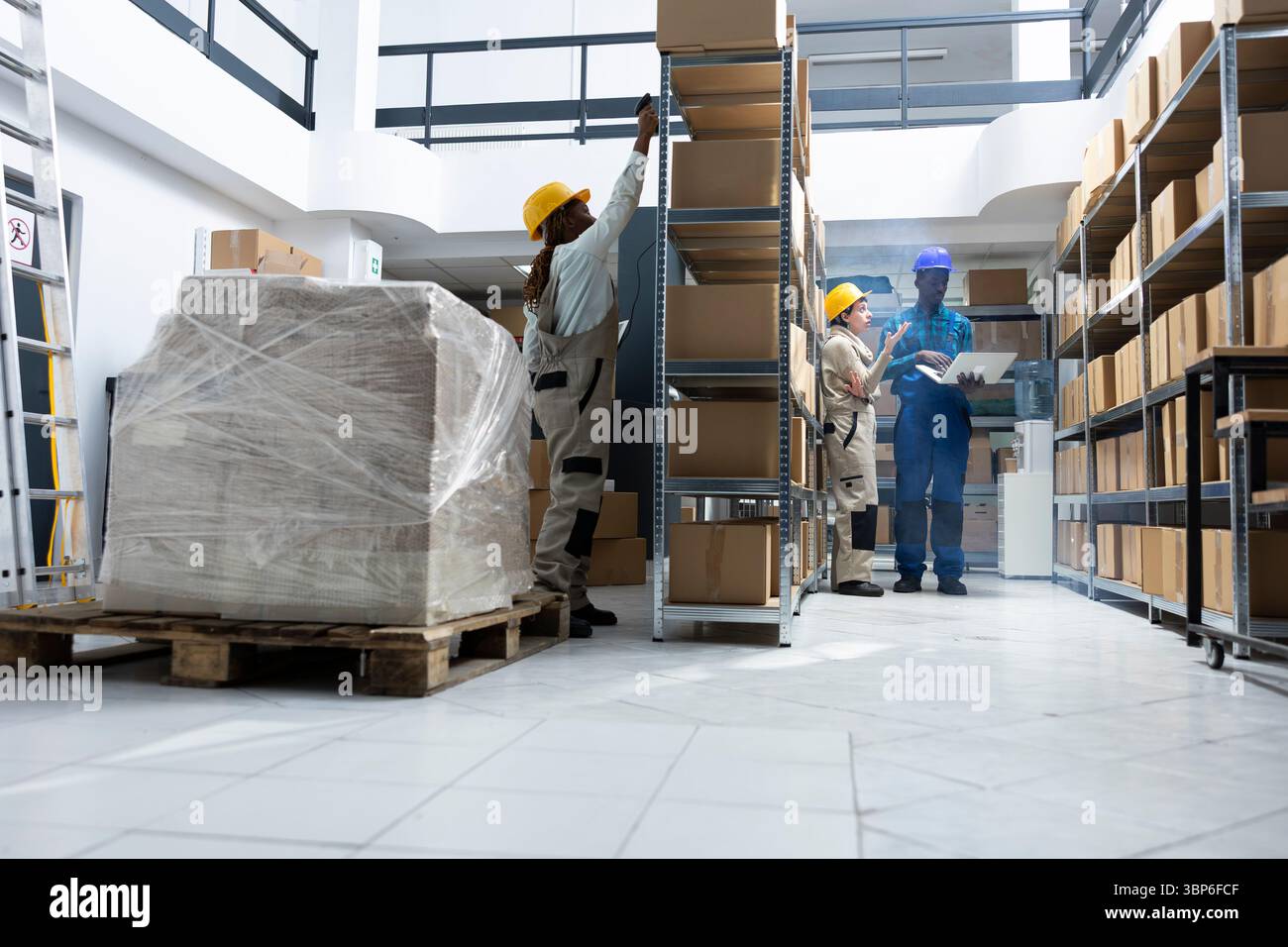 Multiethnic staff work on e commerce orders logistics in storage room ...