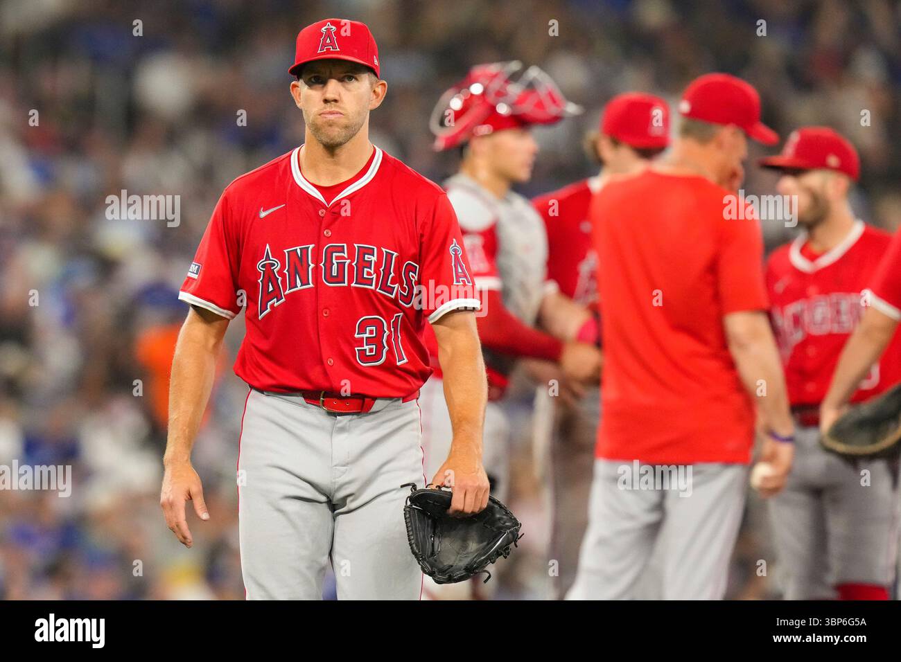 Los Angeles Angels pitcher Tyler Anderson (31) walks back to the dugout ...