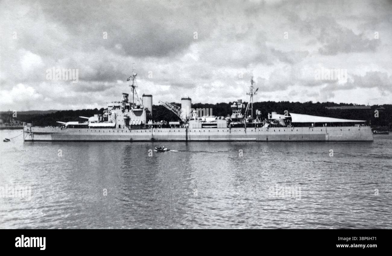 The County-class heavy cruiser HMS London moored in Trincomalee, Ceylon ...