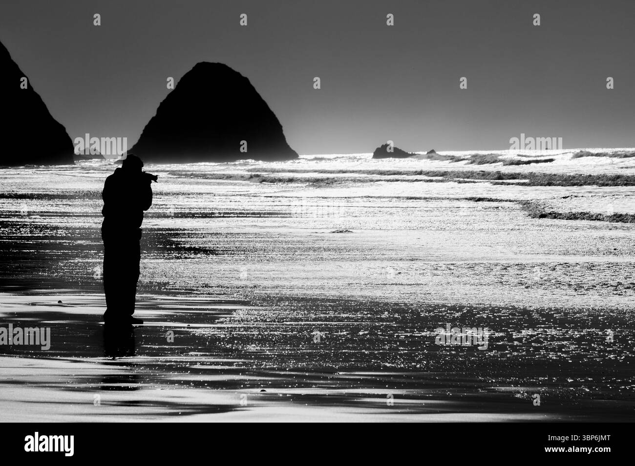Arch Cape, Oregon - November 26th 2015: A photographer captures the ...