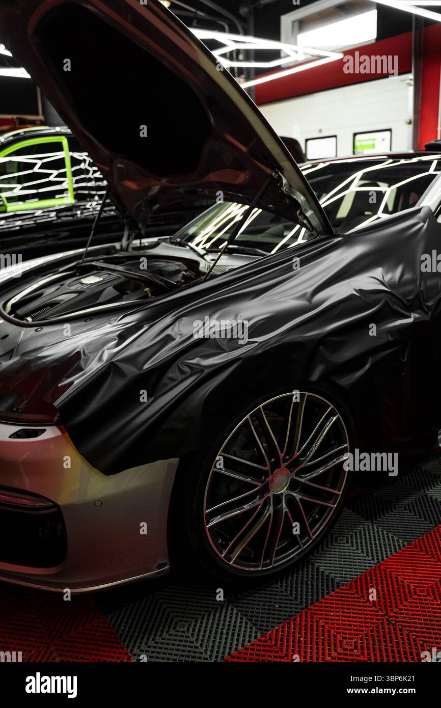 Careful application and tensioning of black vinyl avoids surface damage ...
