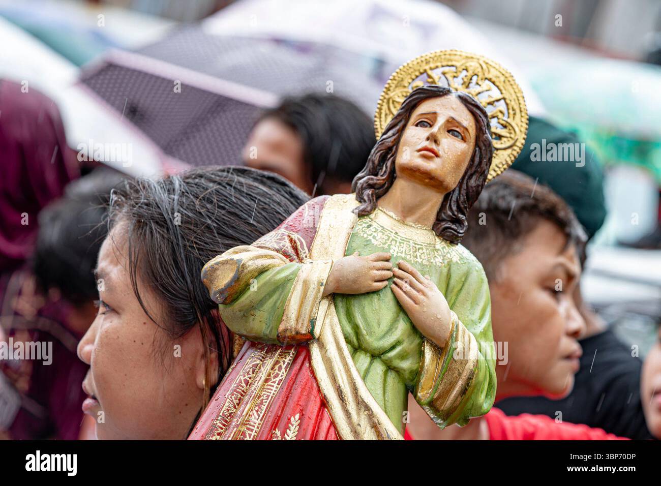Manila, Manila, Philippines. 6th July, 2025. A devotee carries the ...