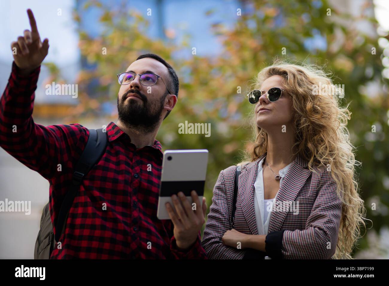 Two professionals engaged in focused hi-res stock photography and ...