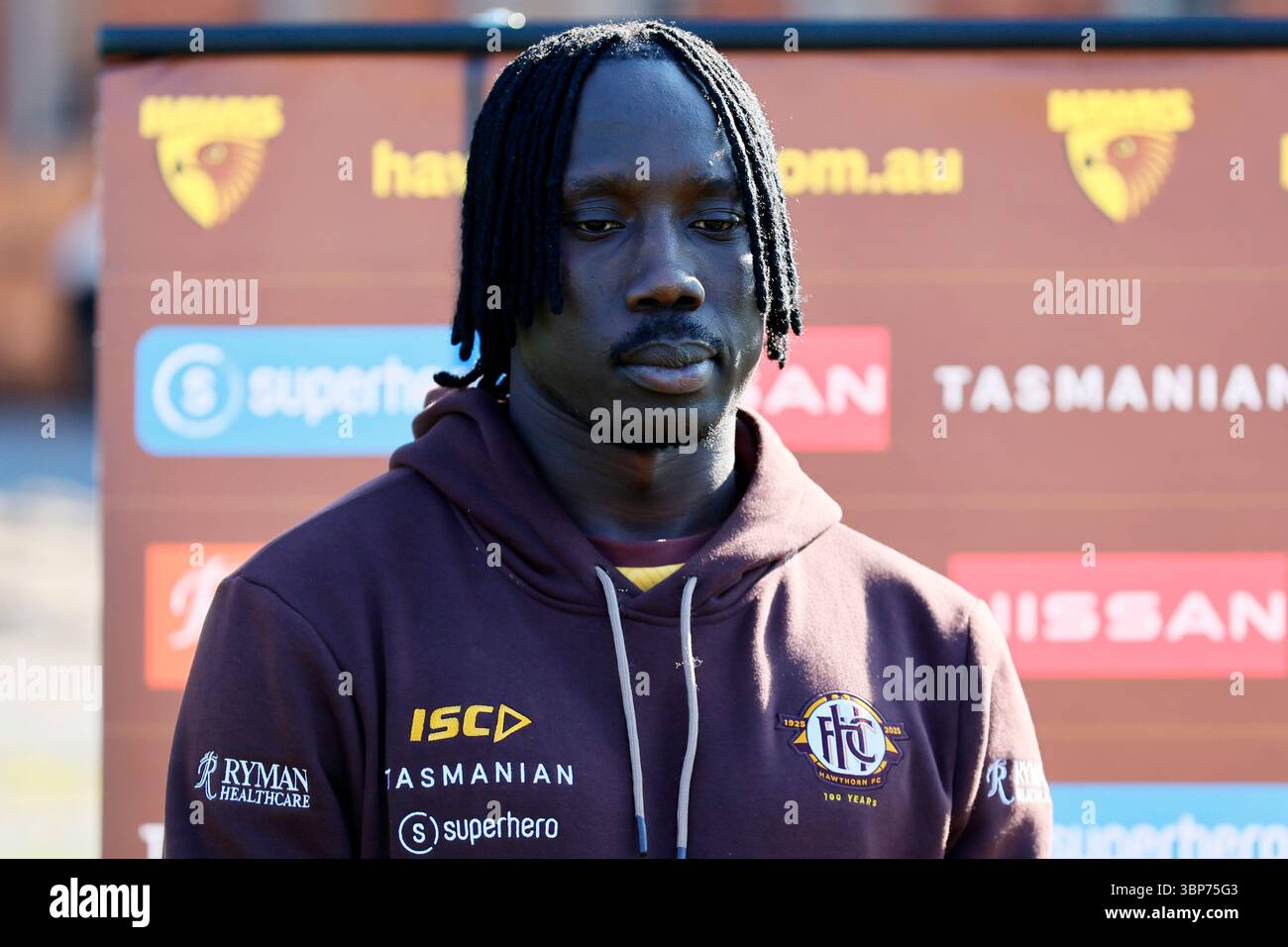 Hawthorn forward Mabior Chol speaks to the media following a training ...