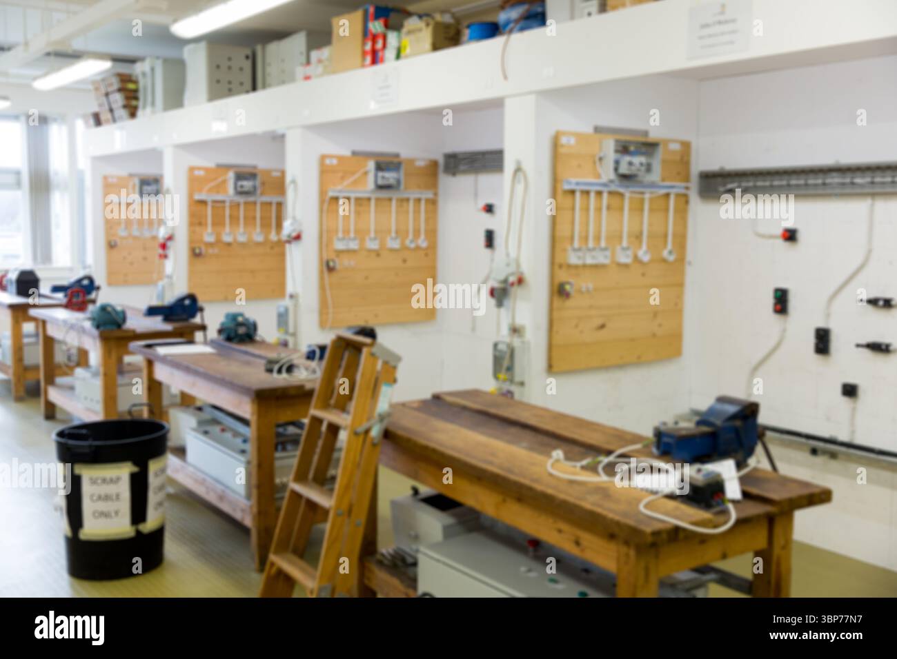 Showing flat design workshop with wooden workbench holding blue vice ...