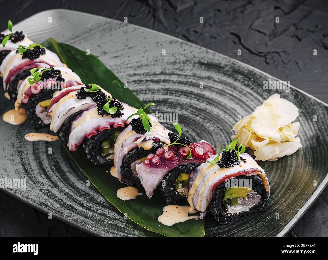 Food, A visually appealing sushi roll features layers of fresh fish and ...