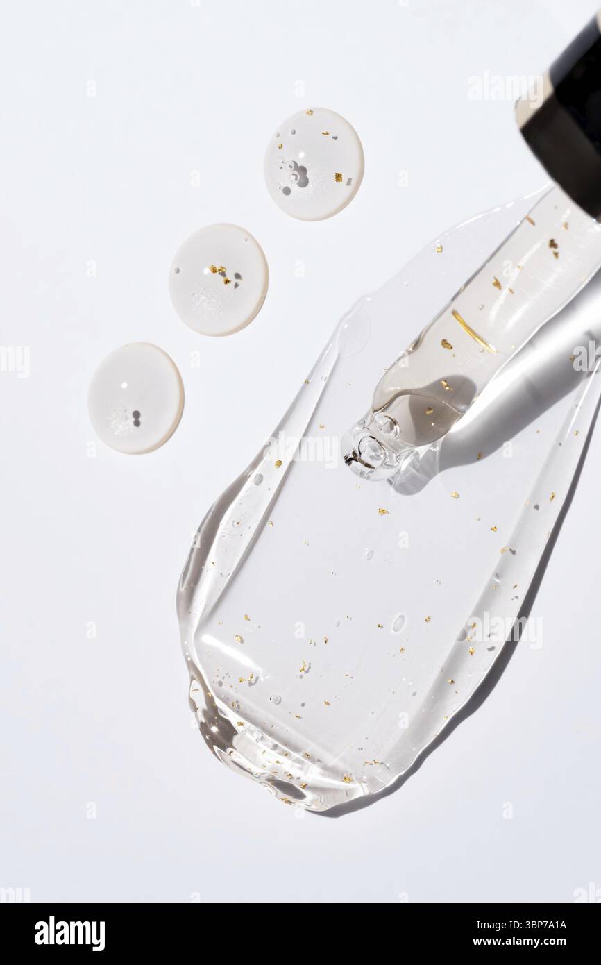 Serum Pipette, drops and smears of cosmetics. Liquid 24k gold gel or a ...