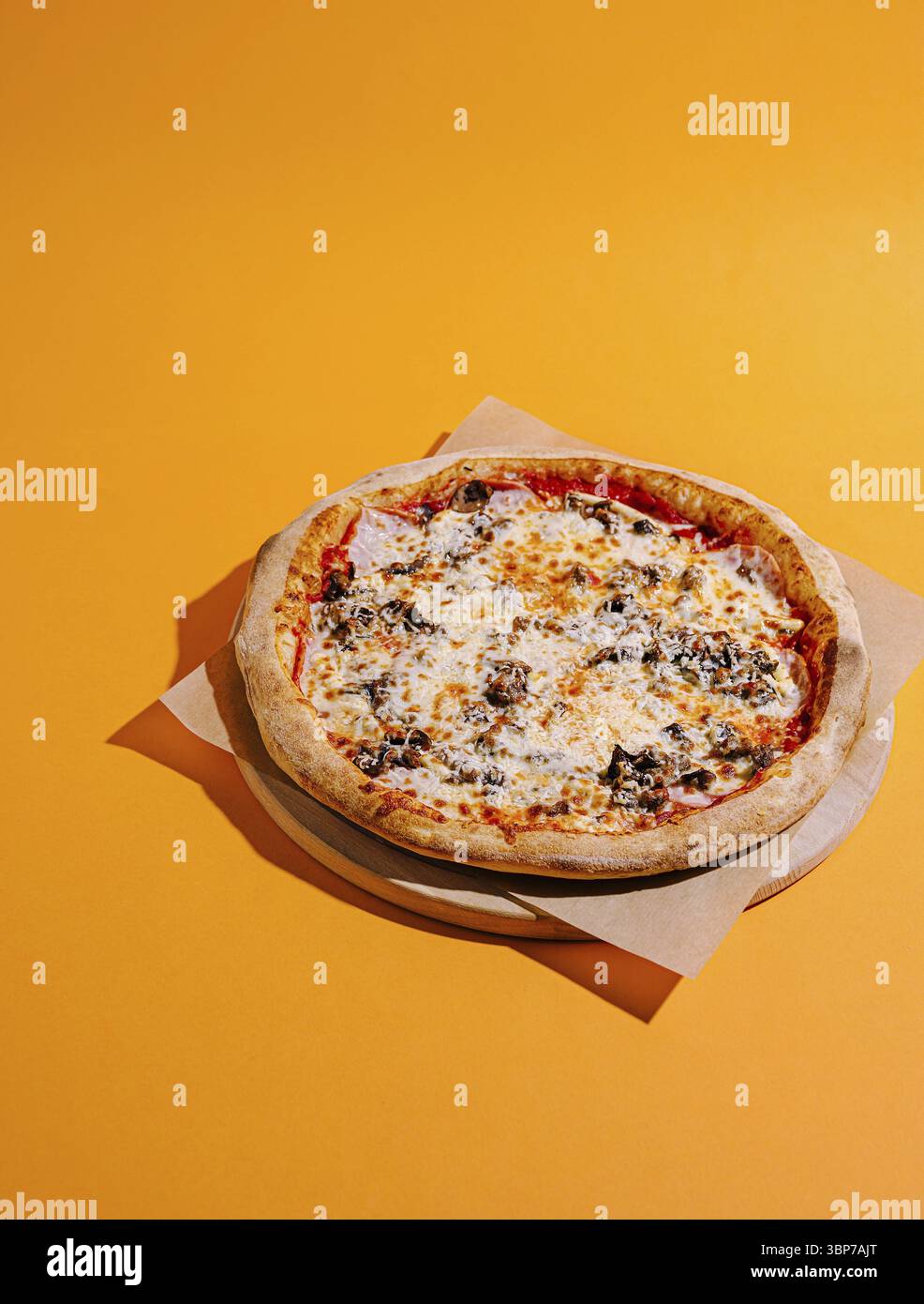 Food, A freshly baked pizza topped with melted cheese and savory meat ...