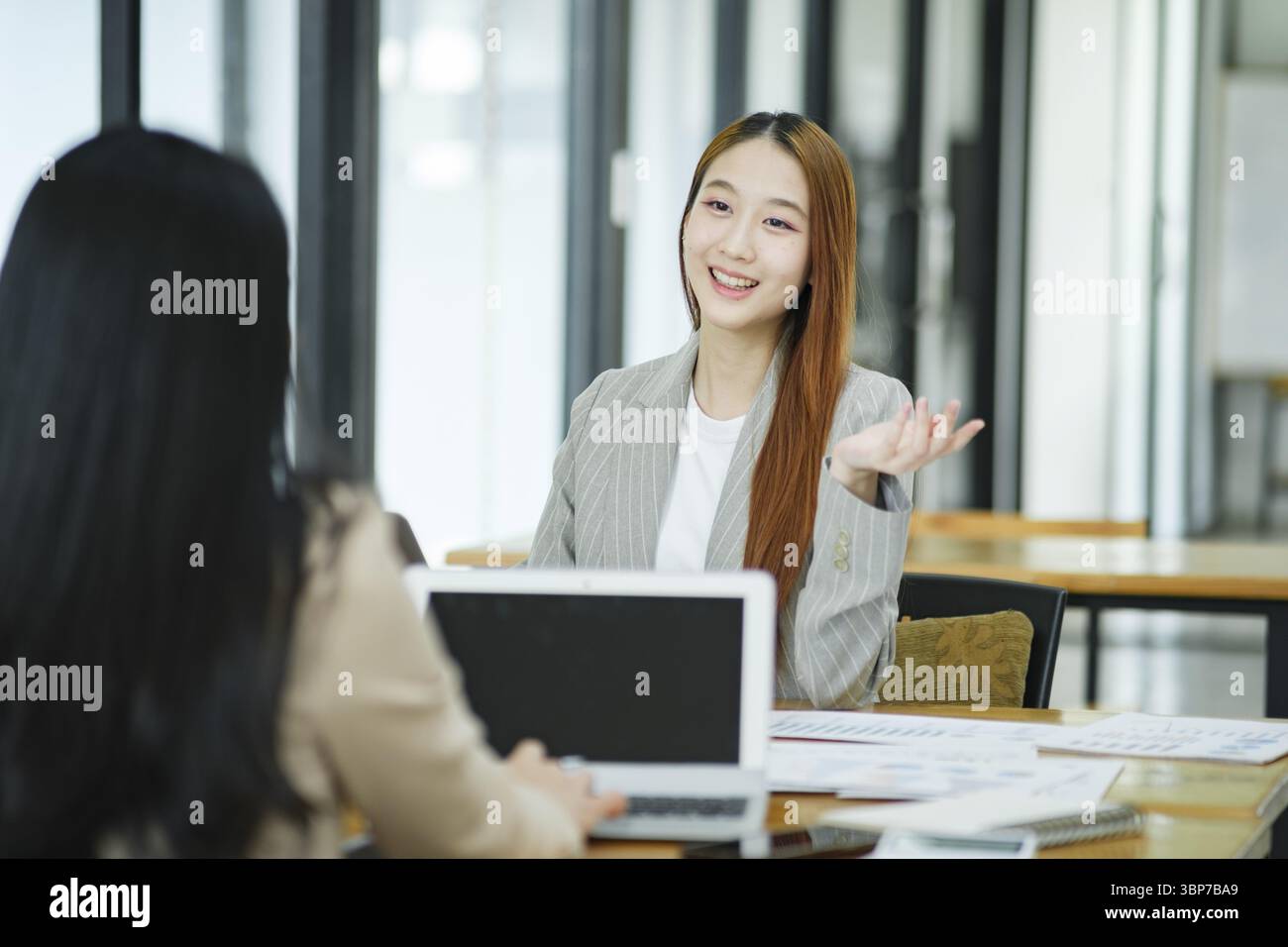 Two serious professionals engaged in hi-res stock photography and images - Alamy
