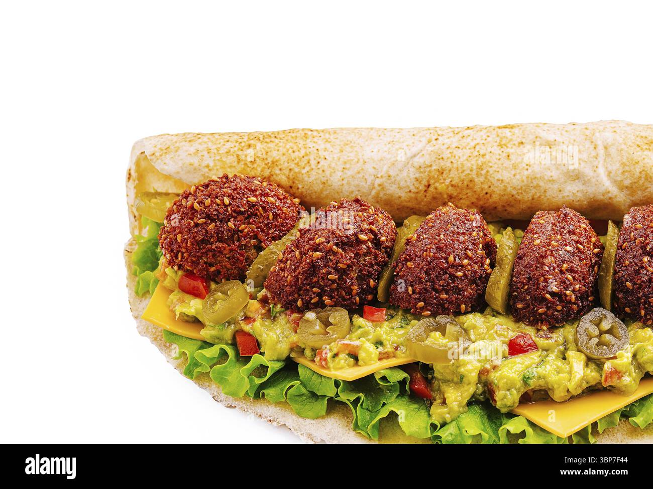 Food, A delicious sandwich features crispy falafel balls, melted cheese ...