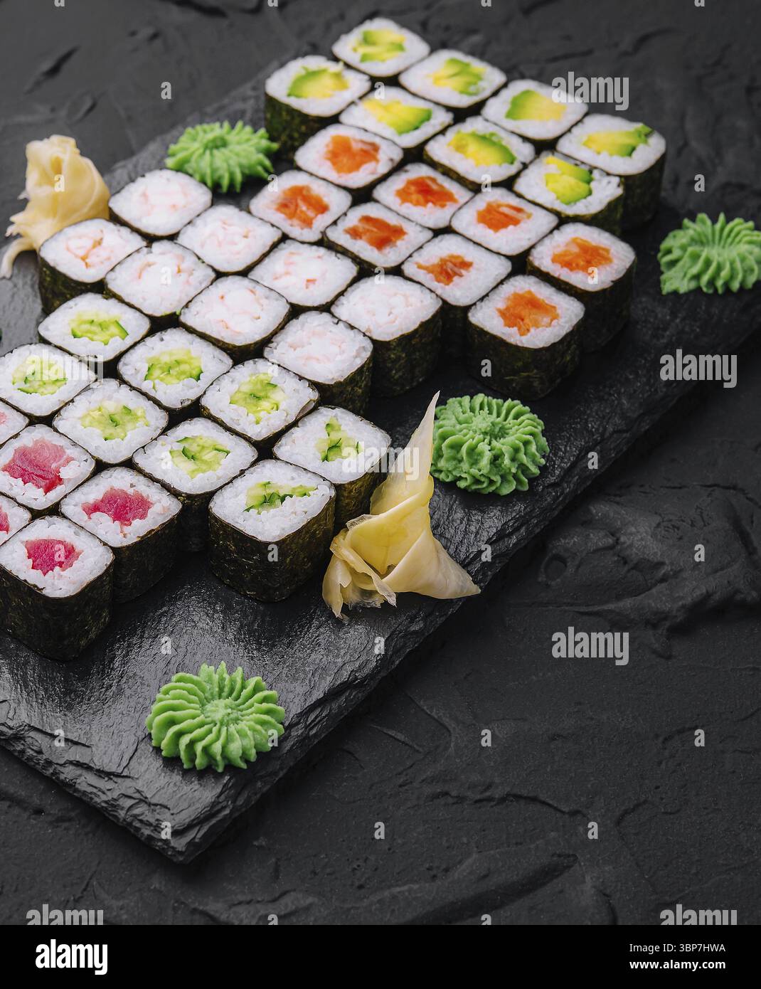 Food, Maki sushi set served on black stone tray Stock Photo - Alamy