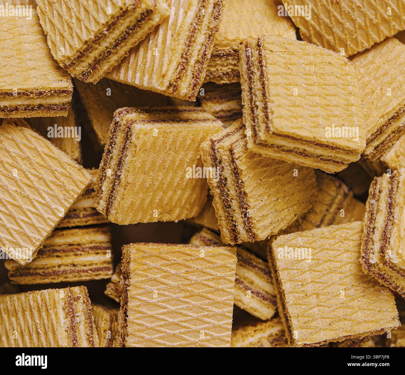 Food, Golden yellow wafers are stacked tightly together, showcasing ...