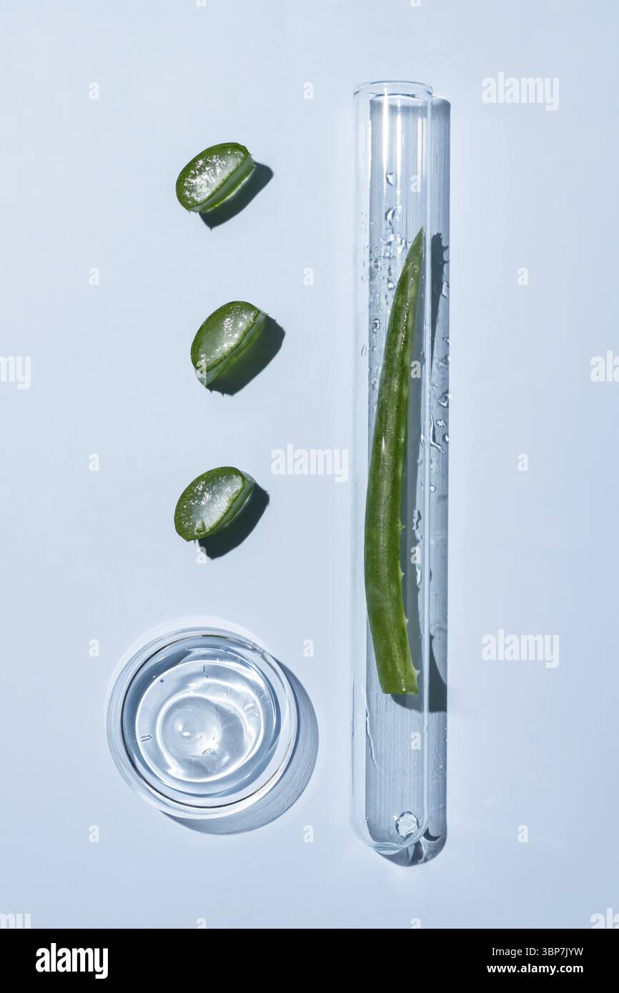 A blue background with samples of a skin care product made of aloe vera ...