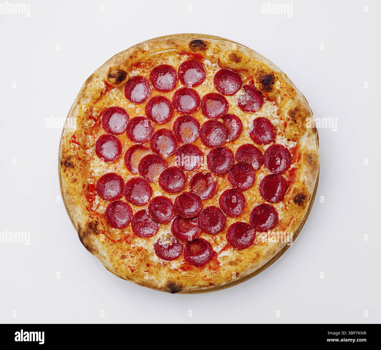 Food, A round pizza topped with pepperoni slices sits on a wooden pizza ...
