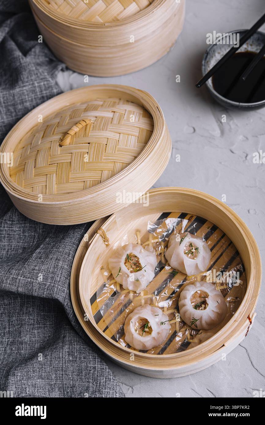 Food, Chinese dumplings being steamed on the traditional bamboo pan ...