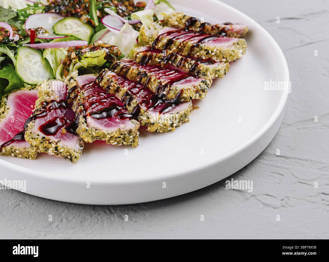 Food, Plate of sesame-crusted tuna with fresh greens and balsamic glaze ...